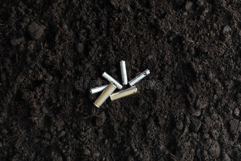 Batteries in the Ground. Environmental Pollution Stock Image - Image of ...