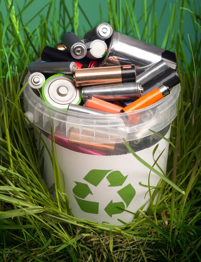 Battery Recycle Bin with Old Element on Wood Table in Grass Stock Image ...