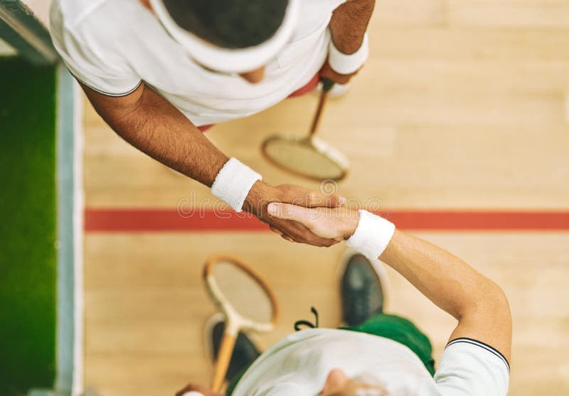 The Battle is on. High Angle Shot of Two Young Men Shaking Hands at a ...