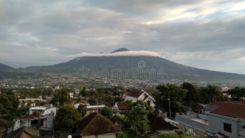 Batu City and Mount Arjuna stock image. Image of tree - 264579181