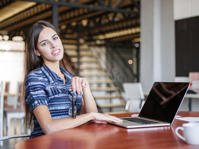 Young Beautiful Girl Working and Posing at the Camera in the Office ...