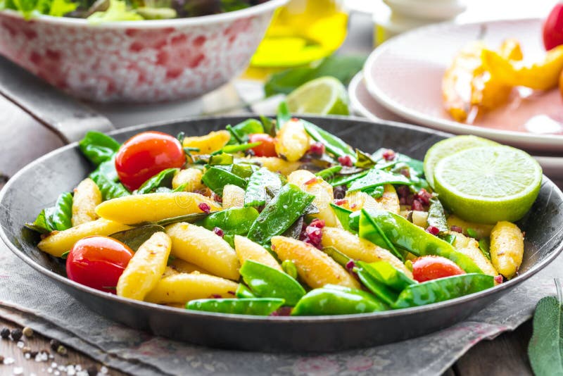 Bavarian Fried Finger-shaped Potato Dumplings with Vegetable. Stock ...