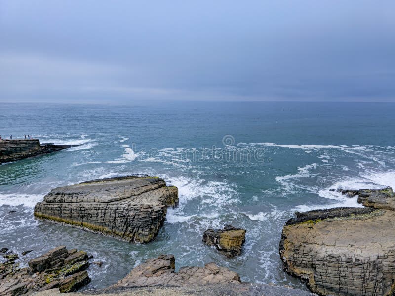 Bay with Cliffs and Rock Islets and Many Waves Stock Photo - Image of ...