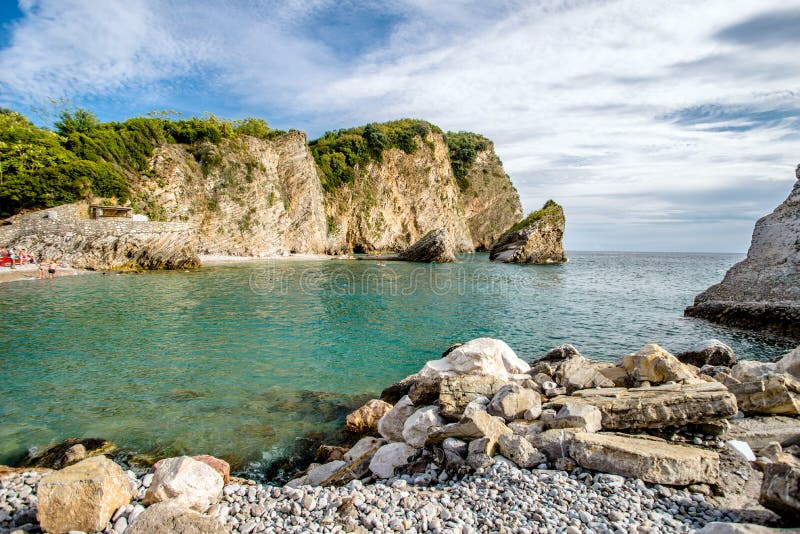 Bay on the Island of St.Nicholas Stock Image - Image of rocky, clouds ...