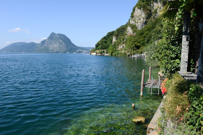 The bay of lake Lugano stock image. Image of travel, season - 58075405