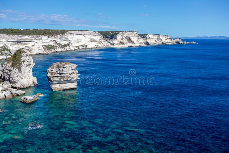 Bay with a Tall Rock in the Center Stock Photo - Image of stones, beach ...