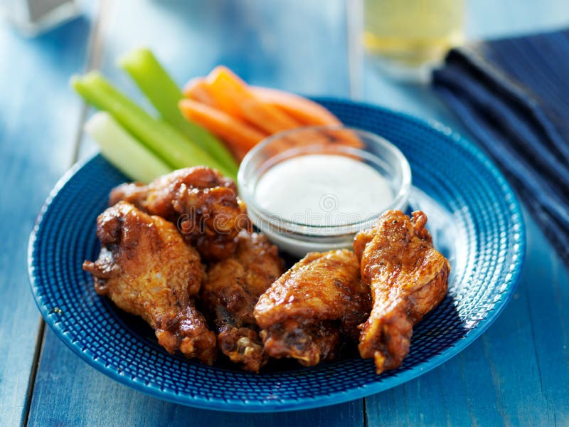 Bbq Buffalo Chicken Wings On Blue Plate With Ranch Dip And Celery Sticks Stock Image Image Of