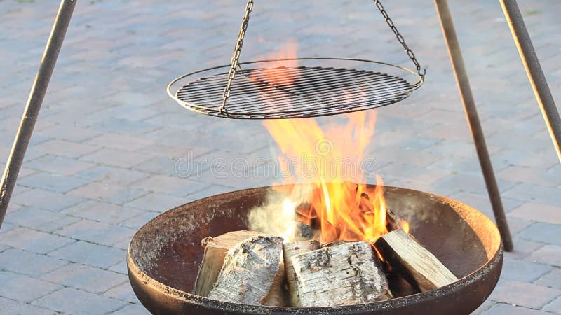 Bbq on hanging grill stock footage. Video of fire, pork - 87819794