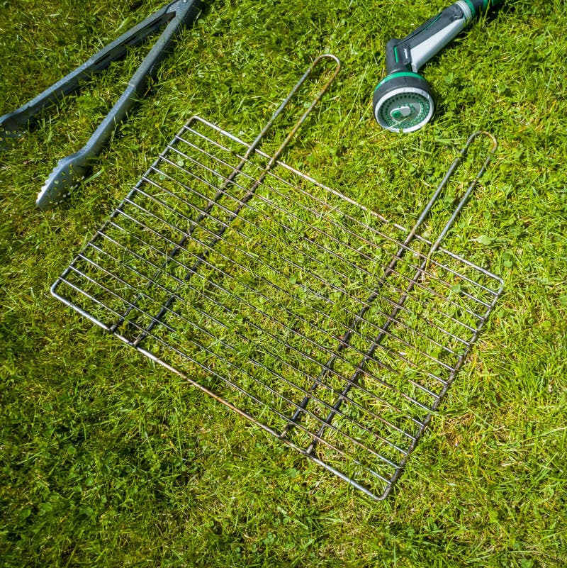 BBQ Grillage Rost Lying on the Wet Lawn Stock Photo - Image of rost ...