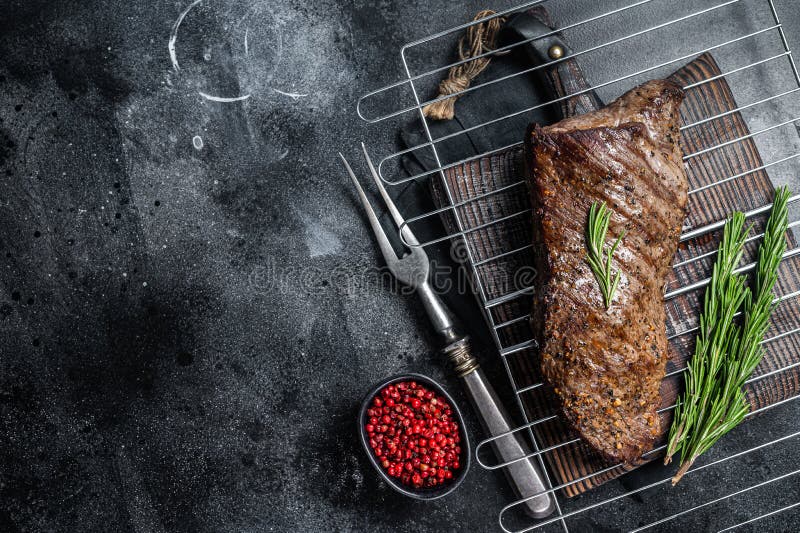 BBQ Grilled Tri Tip Beef Steak on a Grill. Black Background. Top View ...