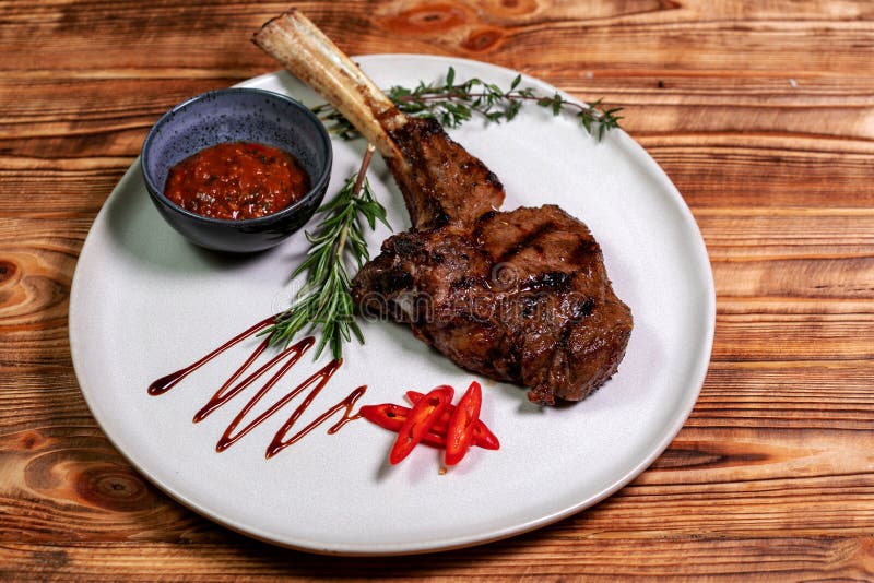 BBQ Lamb rack with tomato stock photo. Image of lime - 240940178