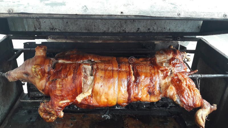 Lechon or Grilled Pork Head on Table. Whole Pig Roasted. Spanish ...
