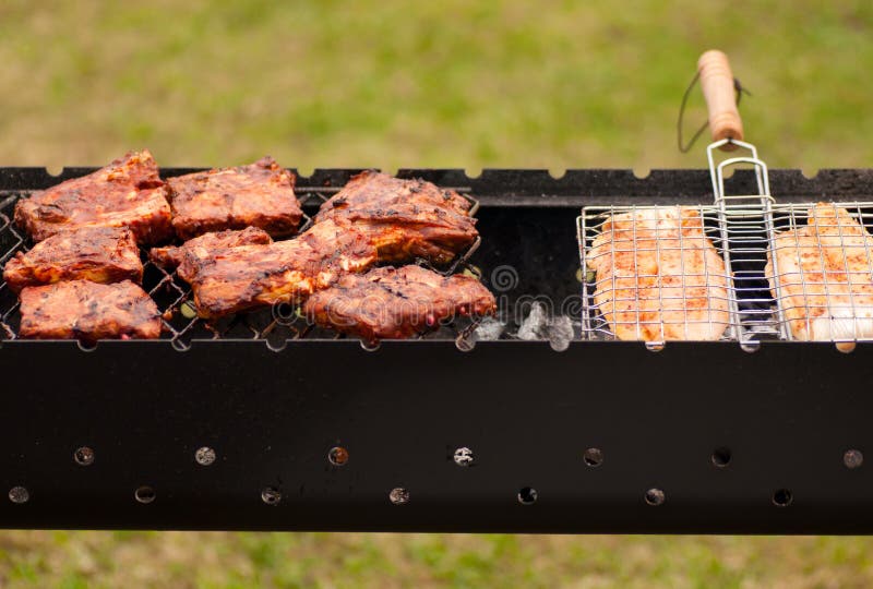 BBQ Ribs and Fish on Grill with Charcoal Stock Photo - Image of pepper ...