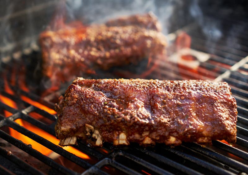 Bbq Ribs Grilling Over Flaming Grill Stock Photo - Image of focus, ribs ...