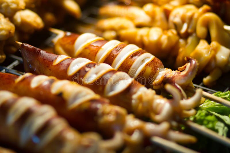 BBQ Squid on a Stick stock image. Image of grilled, stick - 34495583