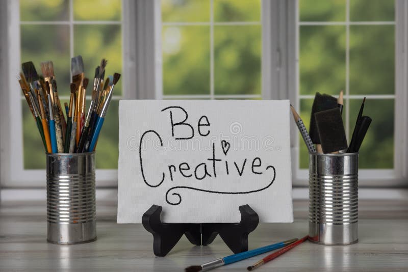 Be Creative, Sign Hand Written on White Canvas Sitting on Easel with ...