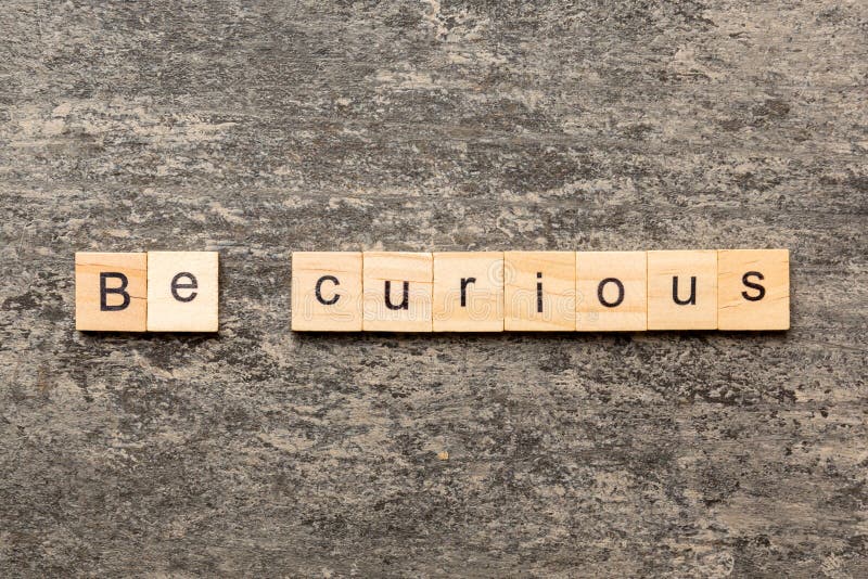 Be Curious Word Written on Wood Block. Be Curious Text on Table ...