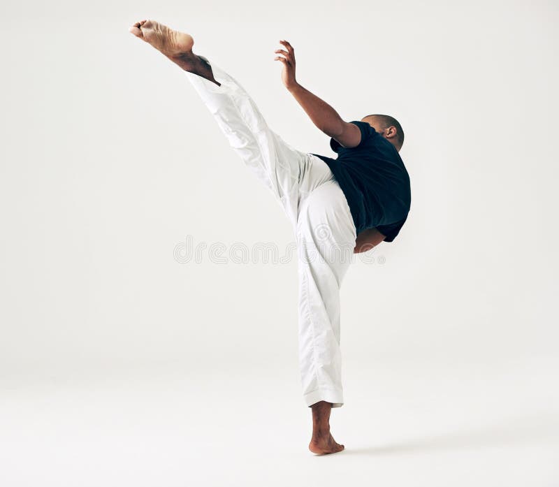 Be Different. Studio Shot of a Young Martial Artist Practicing. Stock ...