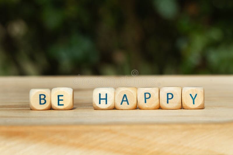 Be Happy Short Phrase Made with Wooden Letter Blocks on a Wooden Table ...