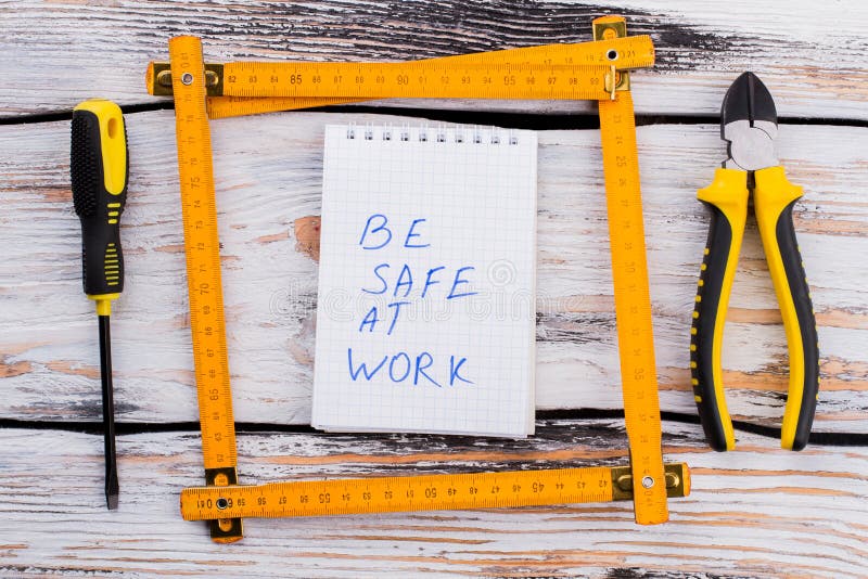 Be Safe at Work Note in a Ruler Frame on White Wooden Table. Stock ...