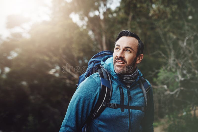 Always Be Sharp and on the Lookout. a Middle Aged Man Hiking in the ...
