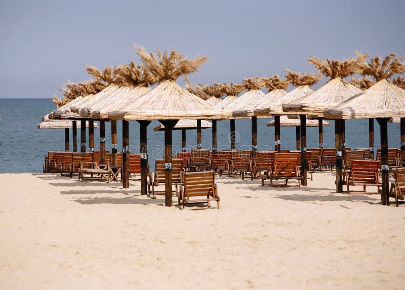 Straw beach umbrellas stock image. Image of sand, beach - 1436813