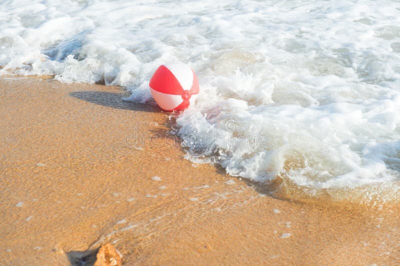 Beach ball in sea stock image. Image of vacation, sand - 75558629