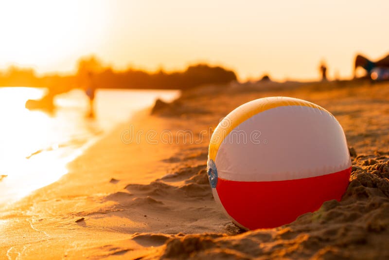 Beach Ball on the Seashore at Sunset Stock Photo - Image of play ...