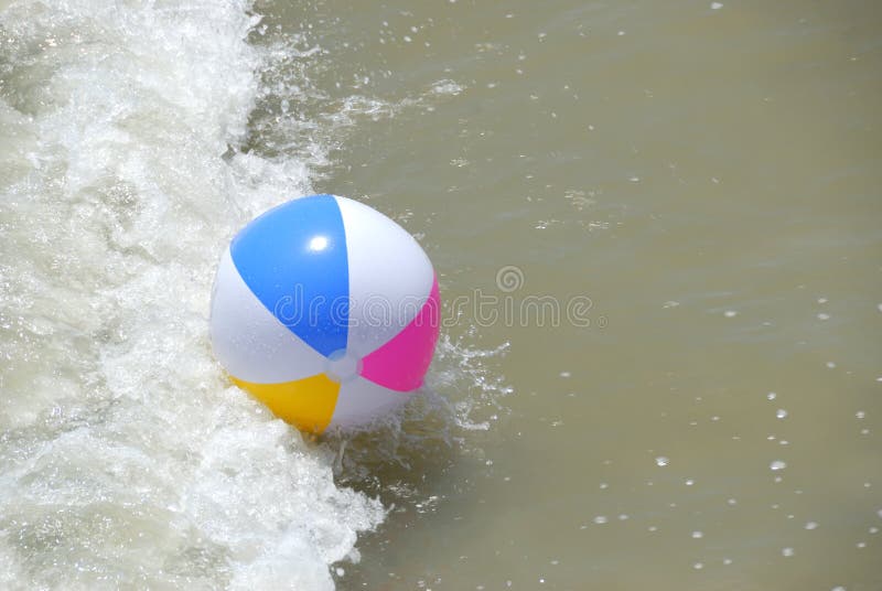 Beach ball in surf stock image. Image of details, sandy - 19601165