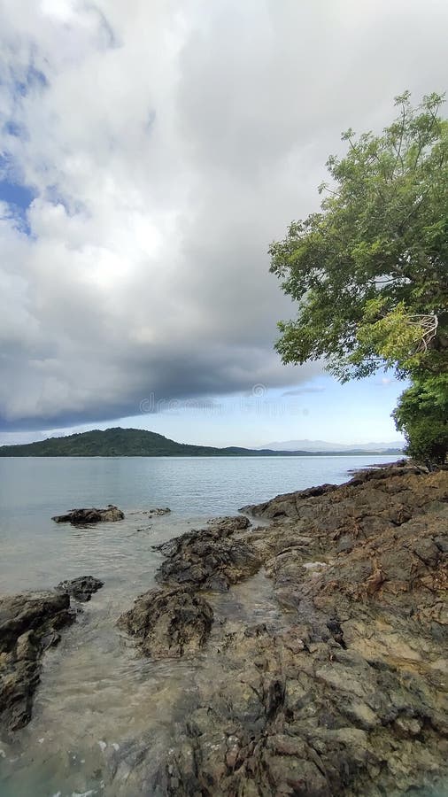 A beach without beach sand stock image. Image of cloud - 236894413