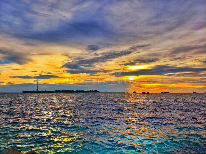 Sunrays Coming Through Clouds Over Sea Stock Photo - Image of resorts ... Sunrays Coming Through Clouds Over Sea Stock Photo - Image of resorts ...
