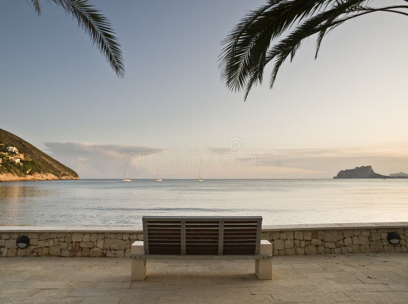 Beach with a Bench stock photo. Image of costa, bench - 16743474