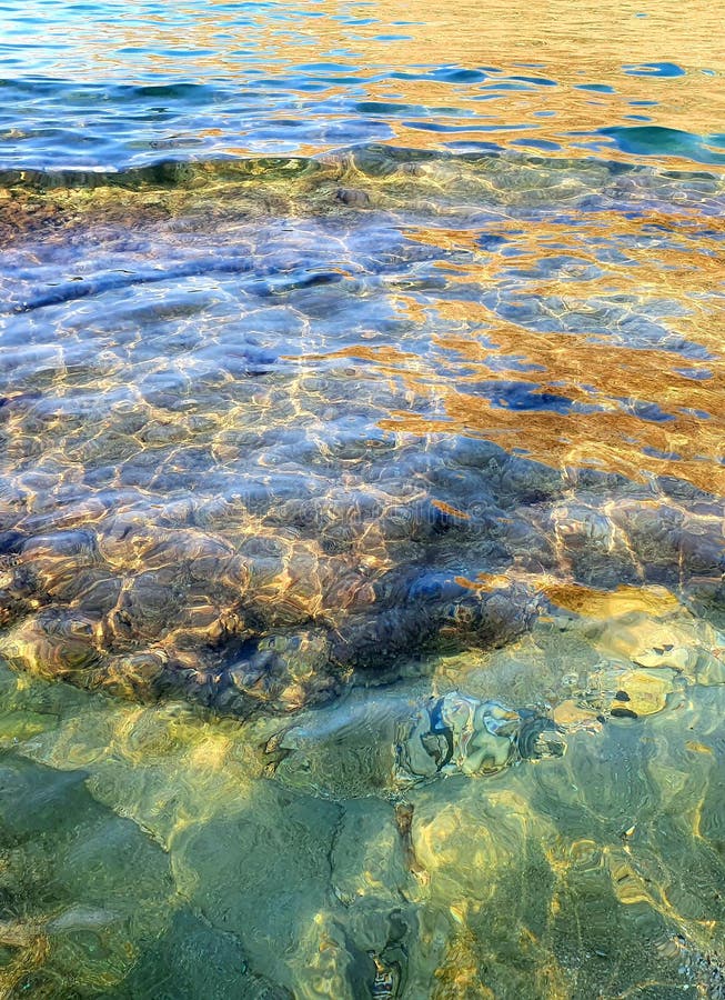 Beach with Blue Sky, Crystal Clear Water and Rocks Stock Photo - Image ...