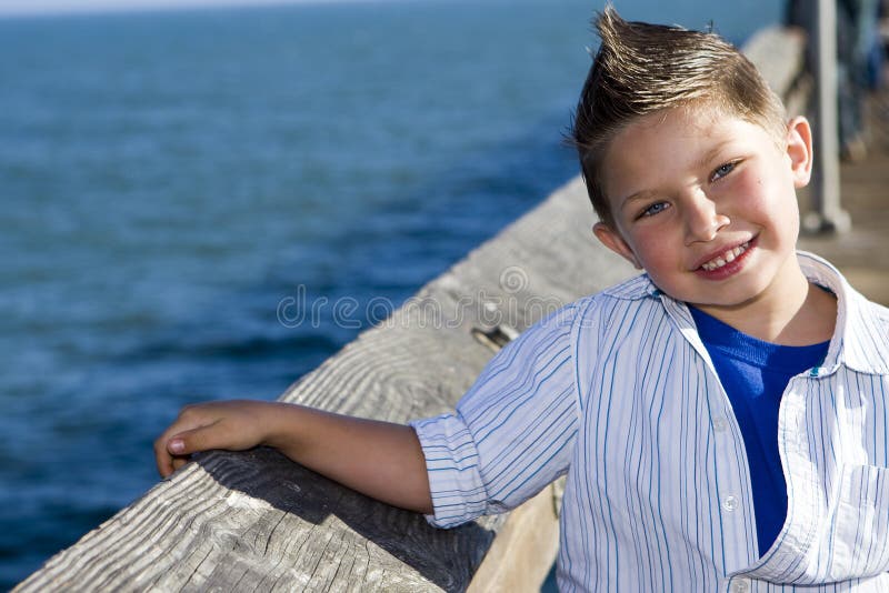 Portrait of Handsome Boy Standing on Beach. Stock Image - Image of blue ...