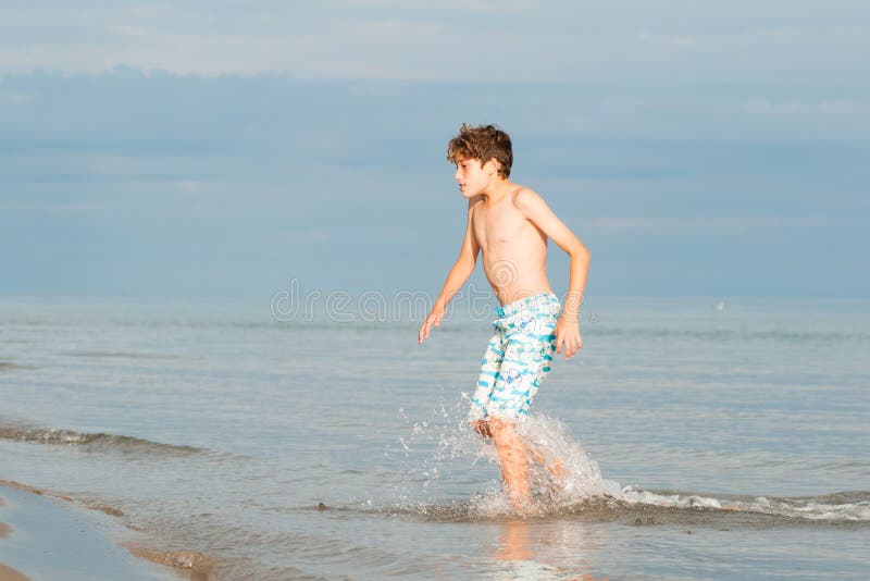 Beach boy stock image. Image of blue, childhood, canada - 74350269
