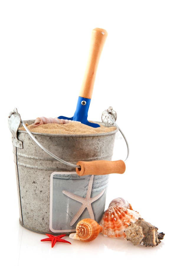 Beach bucket with shells stock photo. Image of shells - 13428982