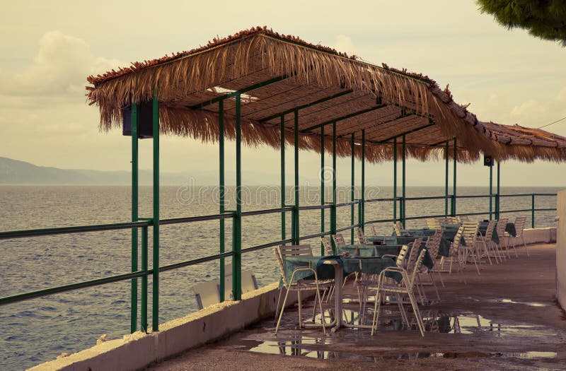 Beach Cafe with Wooden Tables and Chairs at the Sea Stock Photo - Image ...