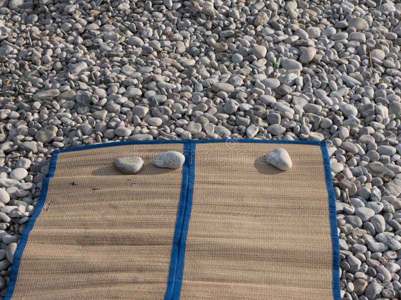 Beach Cane Foldable Mat with Side Lining on Pebble Seaside Top View ...
