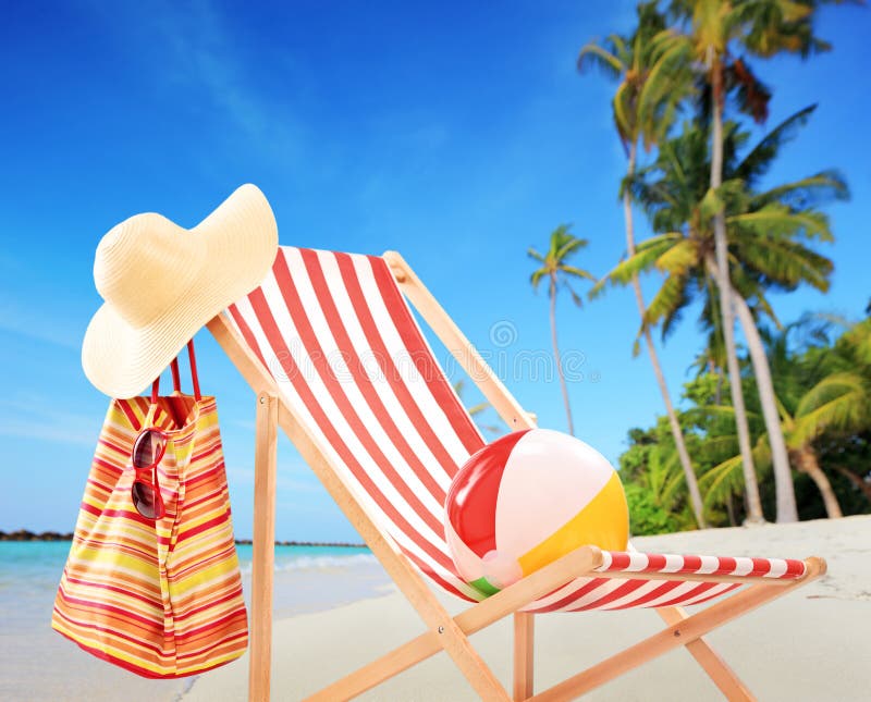 Beach Chair with Accessories on a Tropical Beach with Palms Stock Image ...