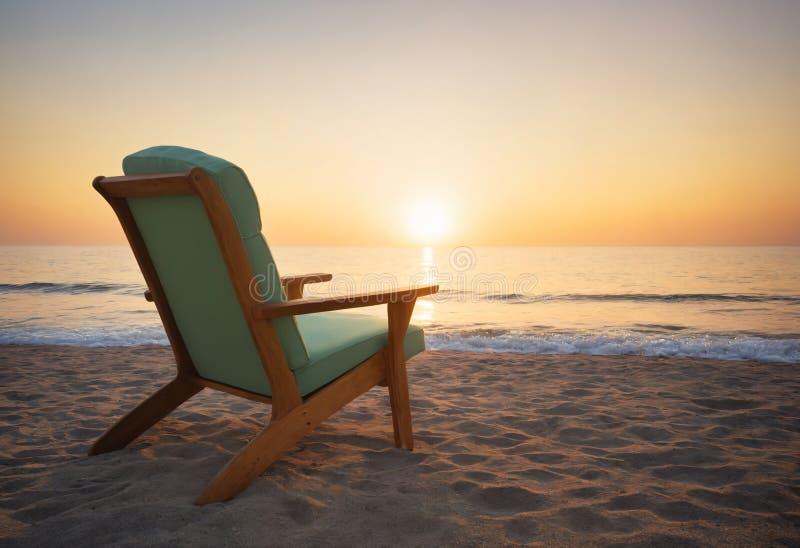 Beach Chair Facing the Ocean at Sunset Stock Photo - Image of sunset ...