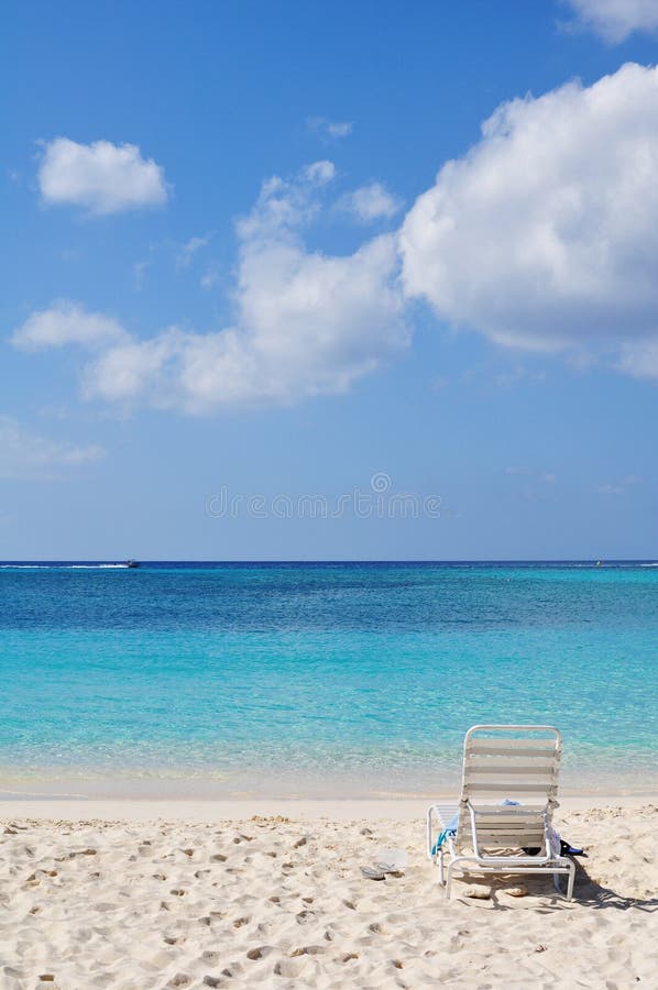Beach Chair on Sand with Blue Ocean Stock Photo - Image of beach ...
