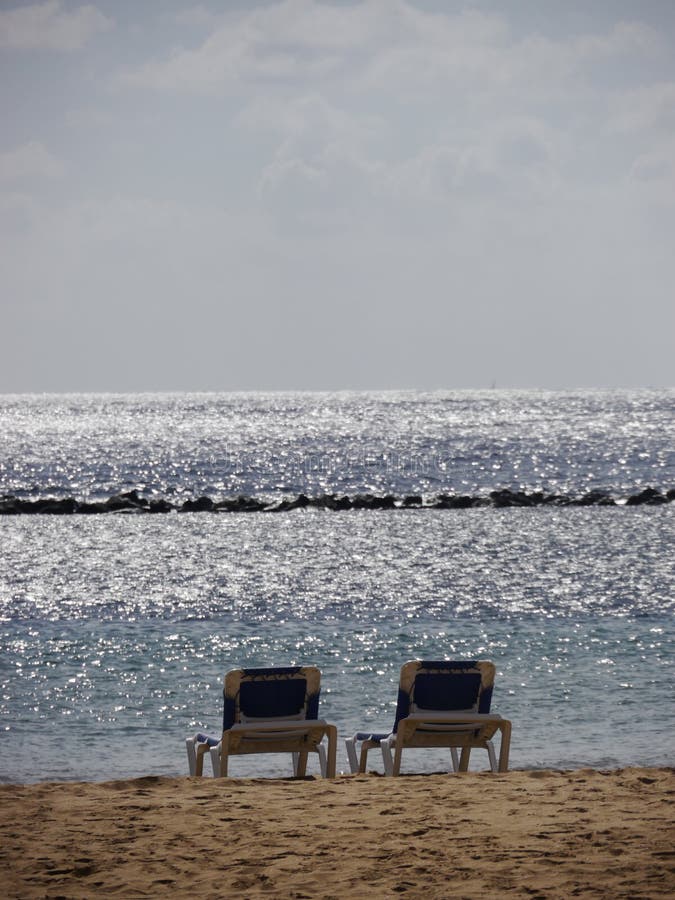 Beach chair sand water stock photo. Image of break, indulgence - 59532966