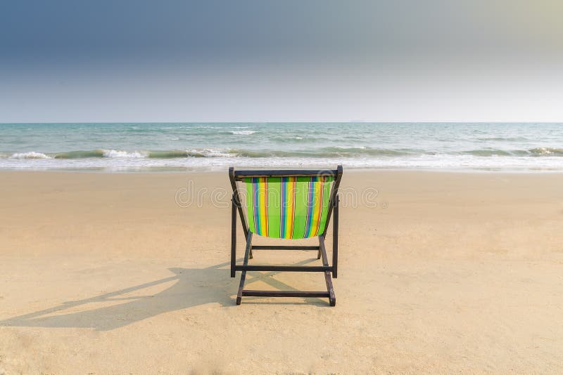 Beach Chair and Shadow on the White Sand Beach with Sunset Light Sky ...