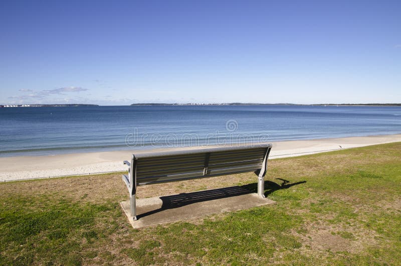 A Beach Bench Seat on Green Grass with Sea View at Brighton Le Sands ...