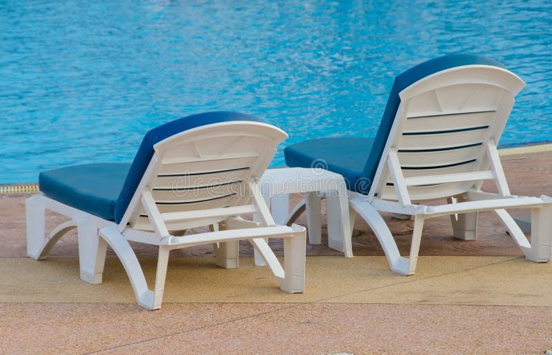 Beach Chairs Near Swimming Pool Stock Photo - Image of ocean, sunny ...