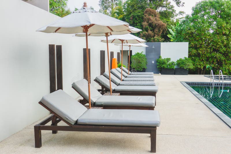 Beach Chairs Near Swimming Pool in Hotel Stock Photo - Image of chair ...