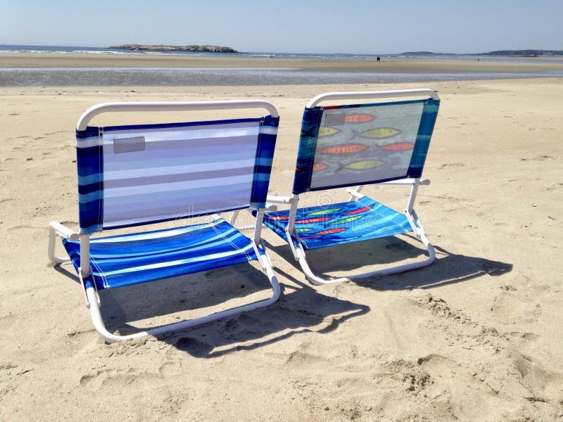 Beach chairs in the sand stock photo. Image of distance - 122155146