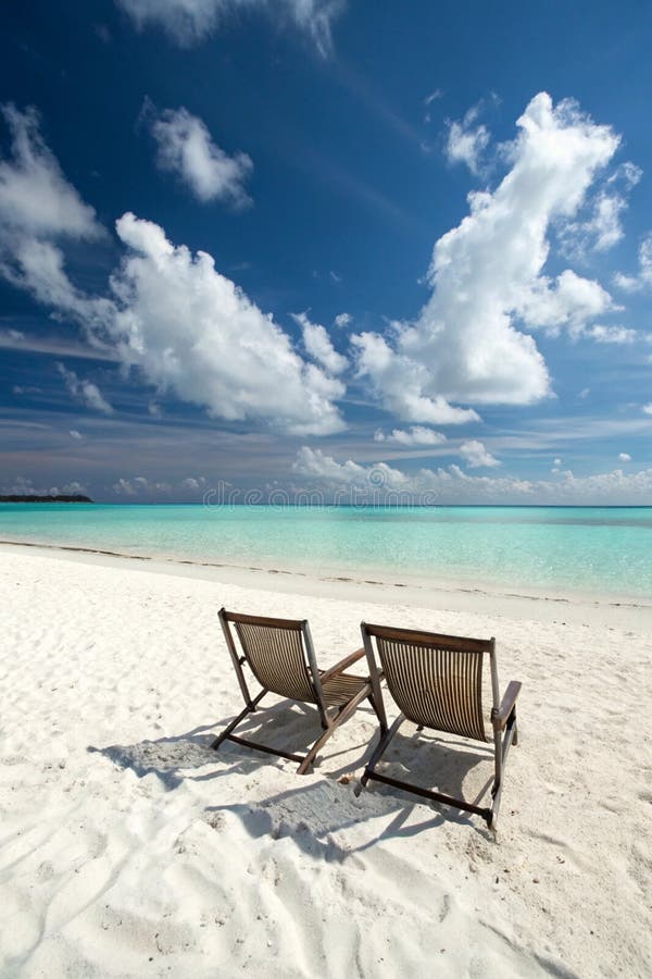 Beach Chairs. Two Sun Chairs on a Deserted Stretch of Pristine Beach ...