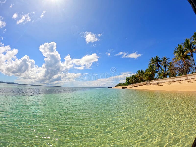 A Beach with Clean Sand and Crystal Clear Sea Water Stock Image - Image ...