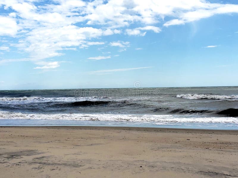 Beach on a Clear Day stock photo. Image of waves, water - 174713024